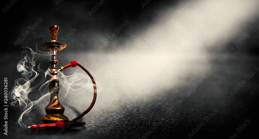 Dark black background of smoking hookah on the concrete floor, in ...
