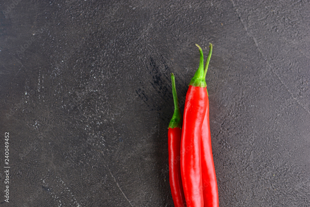 Chili pepper wallpaper. Group of red chilli peppers on a stone ...