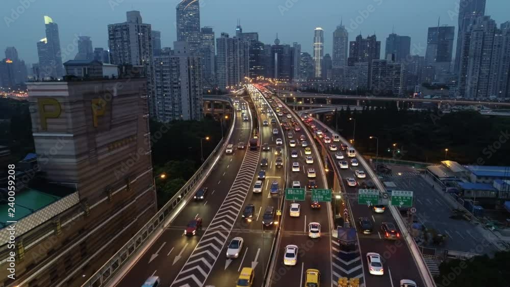 Beautiful drone shot flying over traffic driving across the massive Yan ...