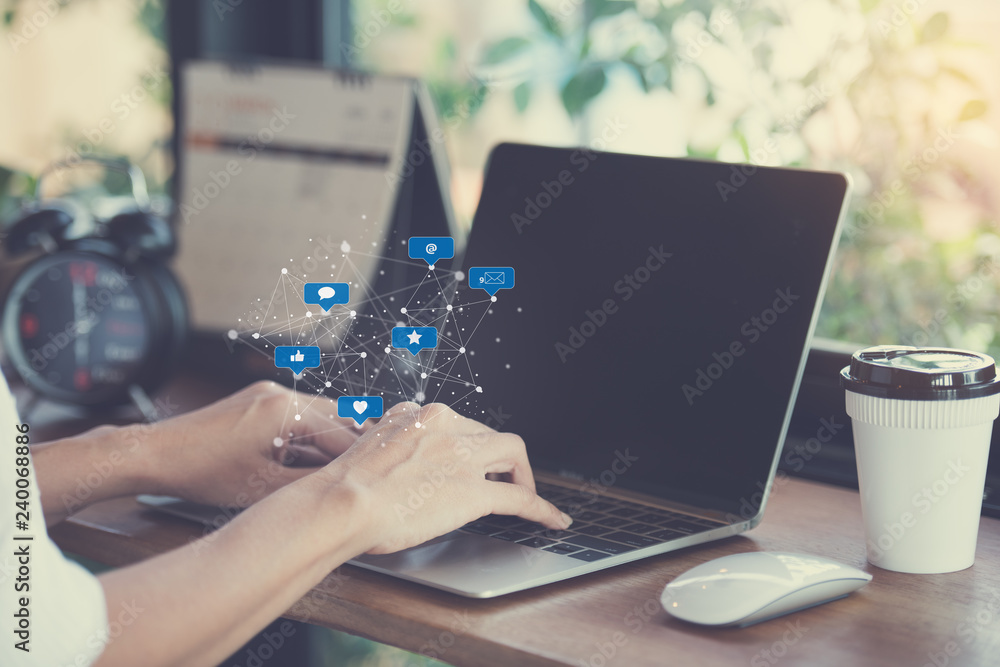 Man using the labtop with Social media icons.Social, media, Marketing ...