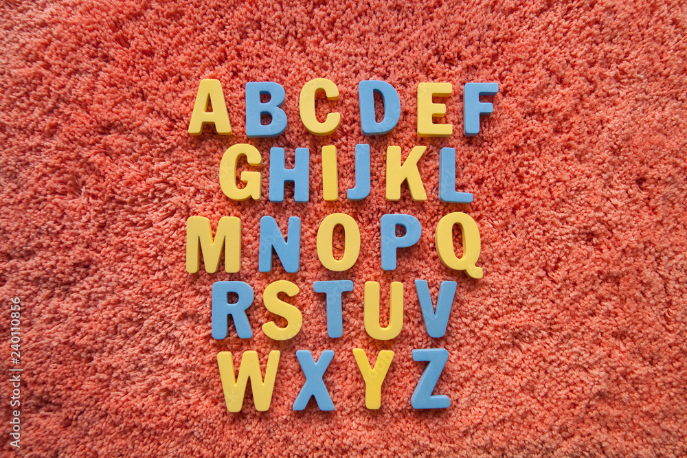 the letters of the alphabet in disorder on a pink background Stock ...