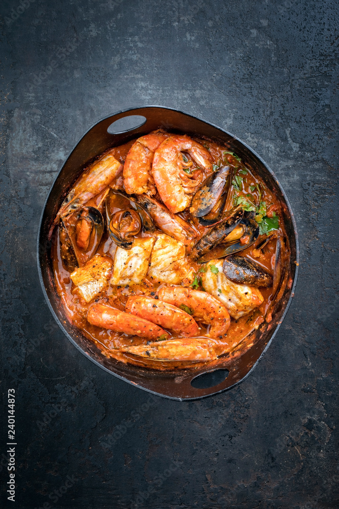 Traditional Catalan fish stew romesco de peix with prawns, mussels and ...