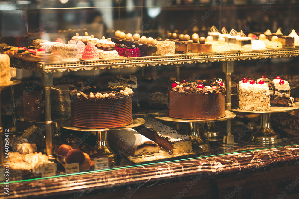 Pastry shop display window with variety of cakes Stock Photo | Adobe Stock