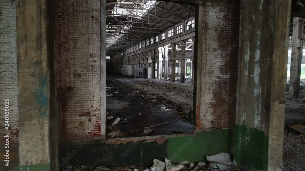 Vidéo Stock Drone flight through the window of an abandoned factory ...
