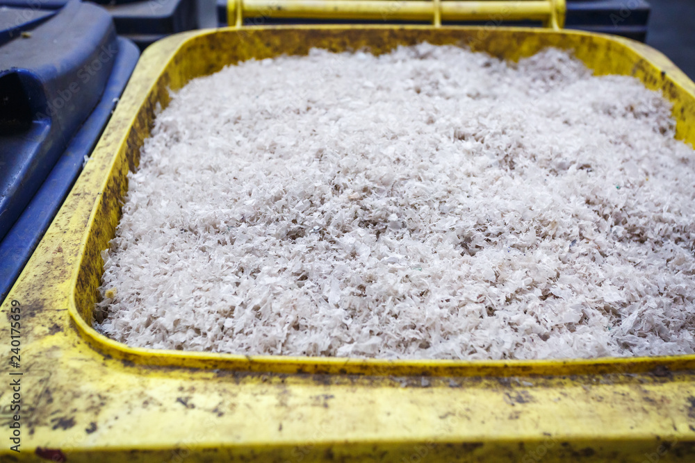 Containers with shredded plastic prepared for further processing ...