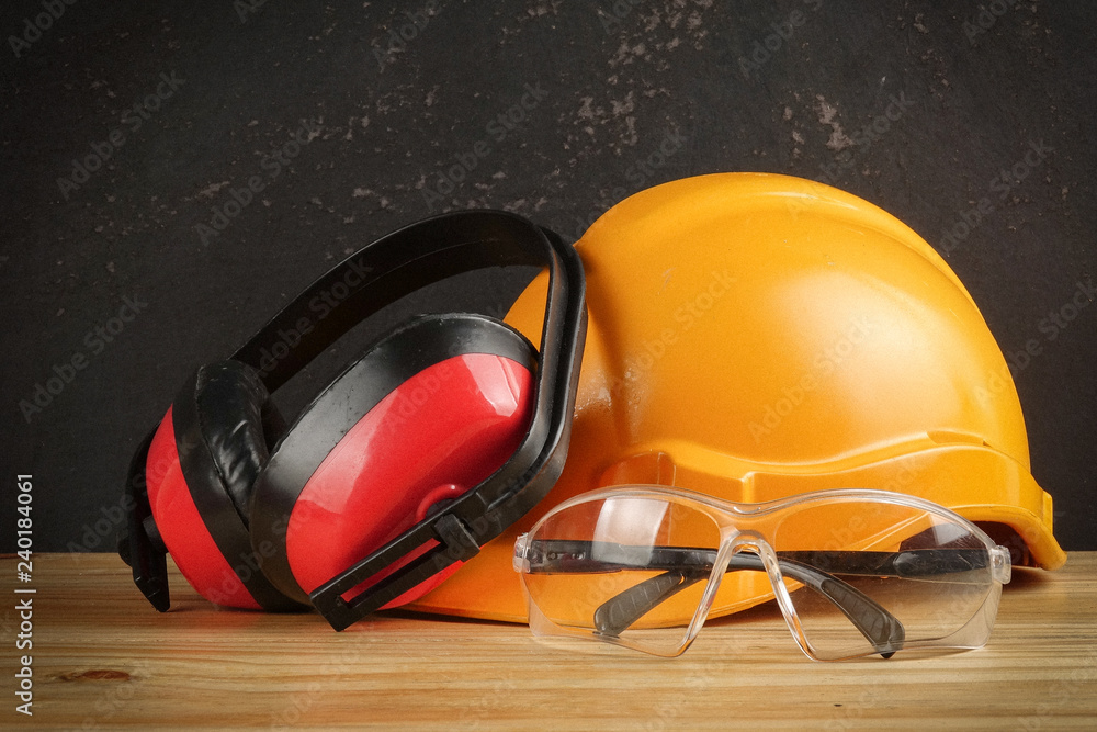 Safety Personal Protective Equipment(PPE) on a rustic black background ...