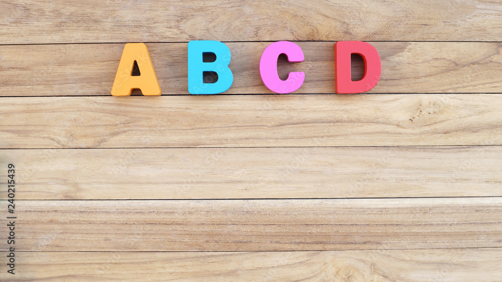 Colorful Letter 'A B C D ' on Wooden Table For Beginning English ...