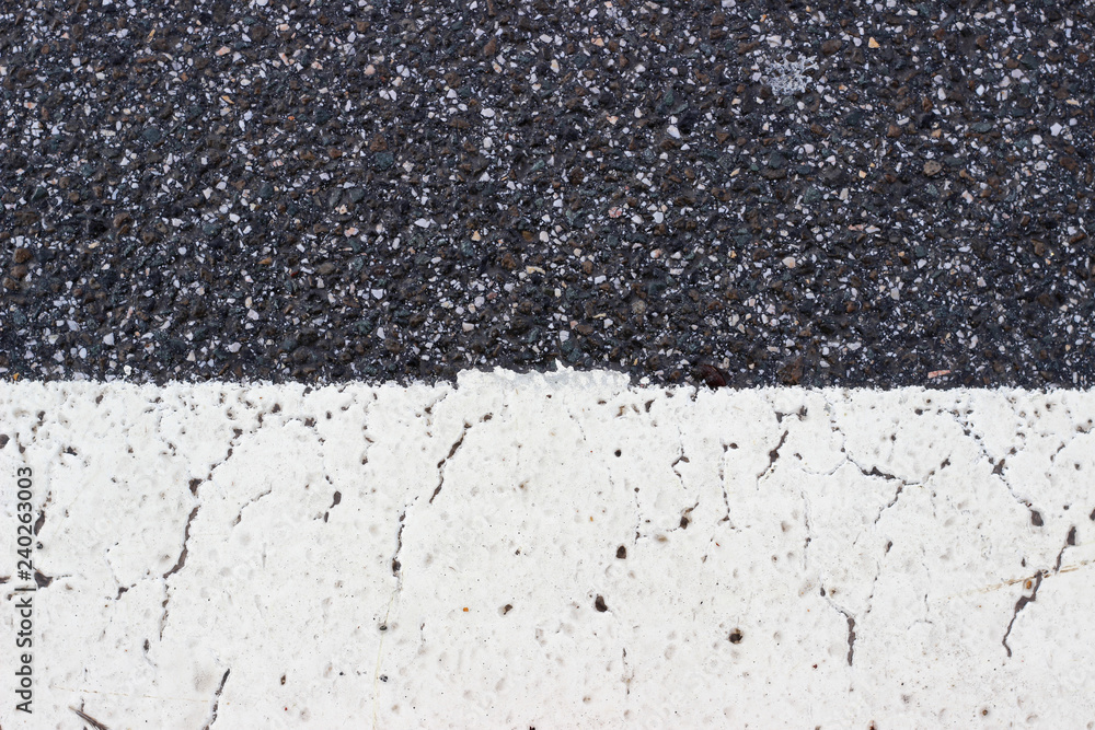 Asphalt pavement sign marking crosswalk white paint wet old surface ...