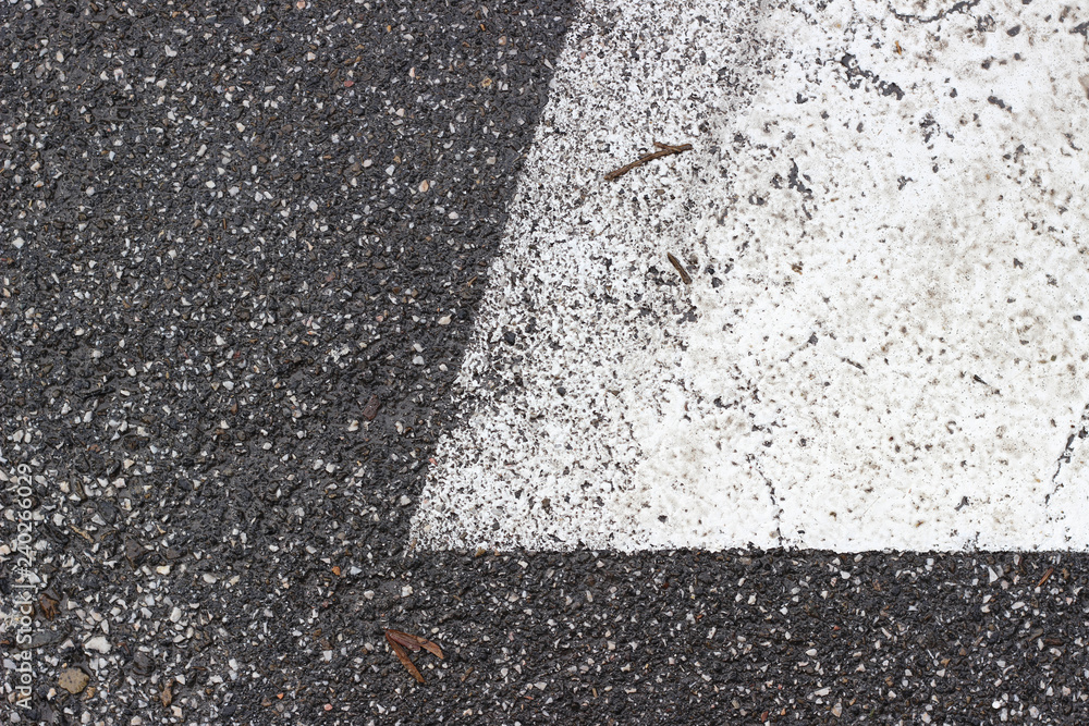 Asphalt pavement sign marking crosswalk white paint wet old surface ...