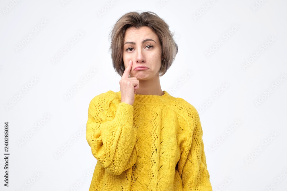 Young Serious And Concerned Woman Crying Desperate Overacting On