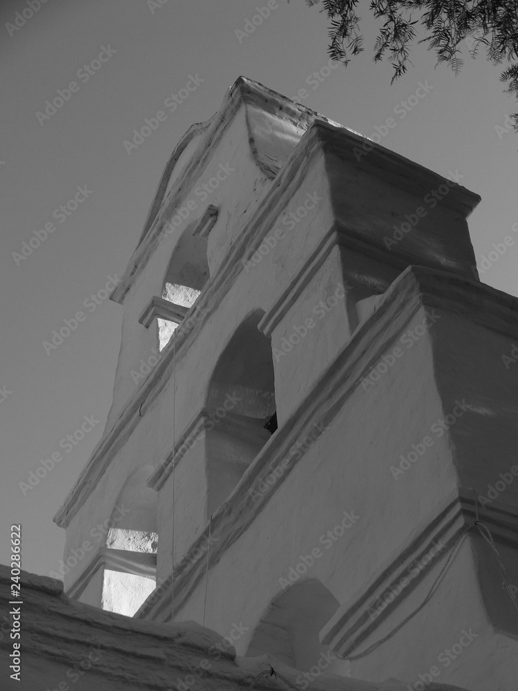 Monochrome image of the historic adobe tower at the California Mission ...