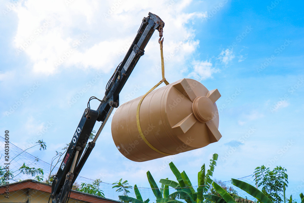 Lifting Water Tank with Crane, water tank Stock Photo | Adobe Stock