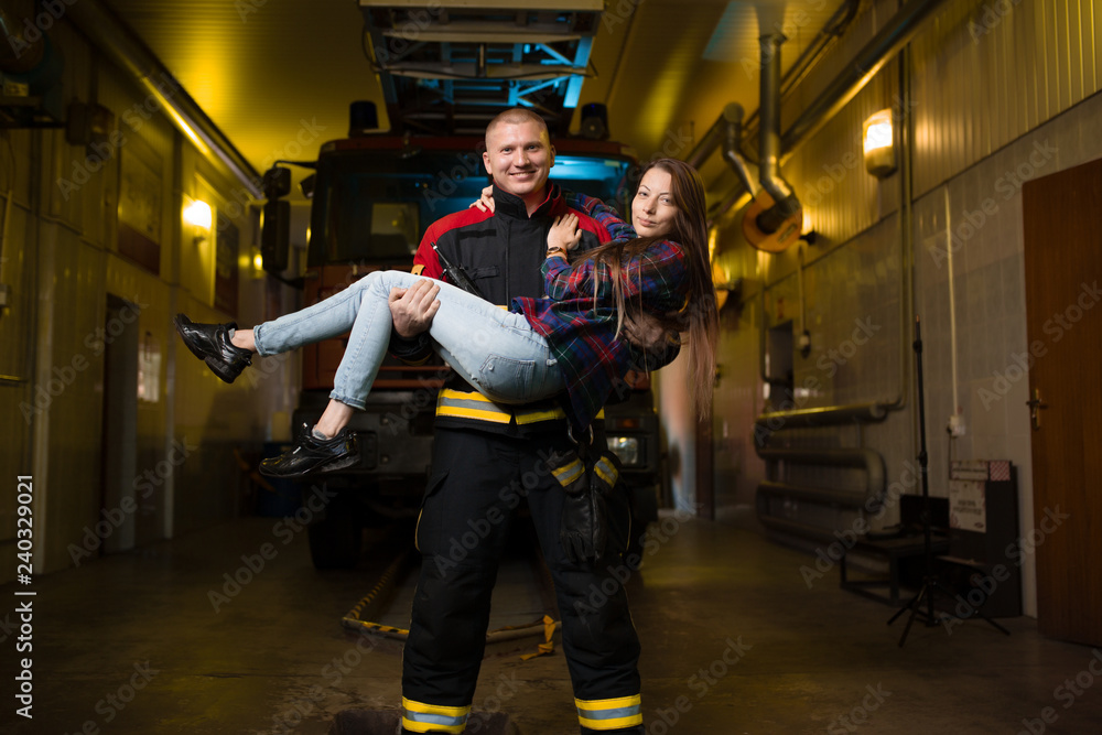 Firefighter Carrying Woman