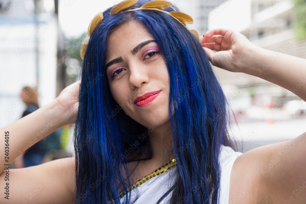 Carnaval party. Woman in costume in the city Carnival. Having fun in ...