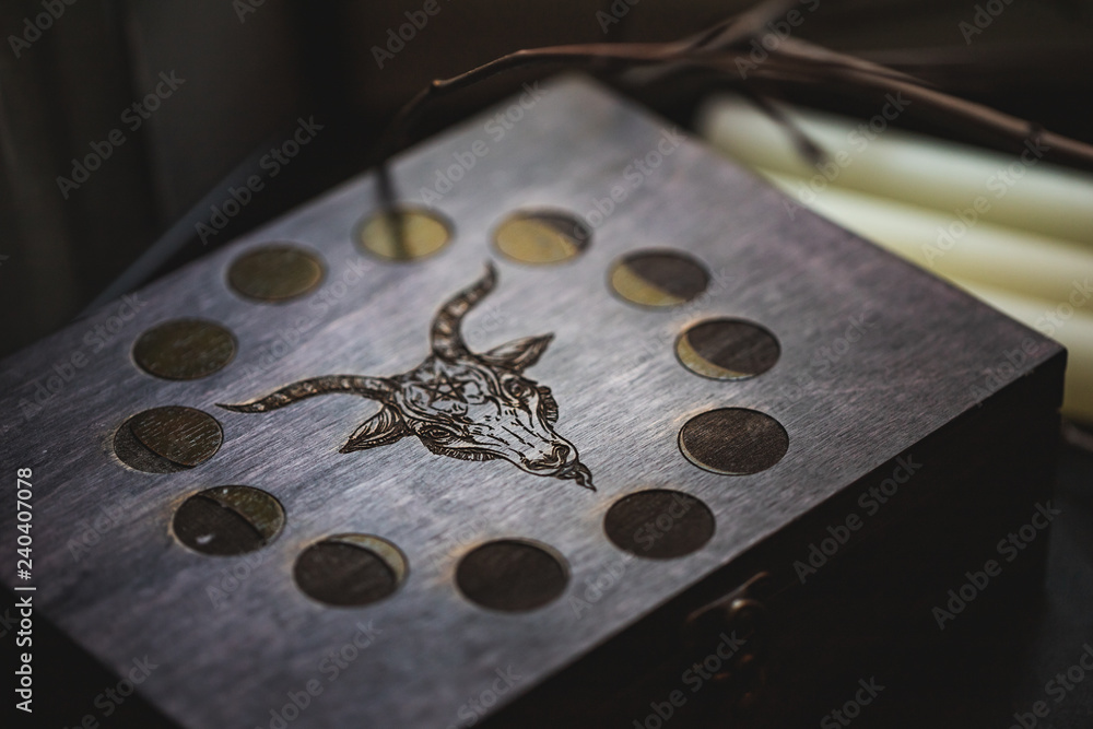 Wooden carved box with the image of Baphomet's head and moon phases ...