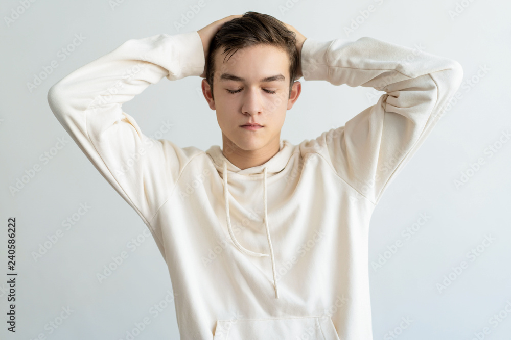 Worried teen boy clutching head. Tensed young guy thinking with his ...