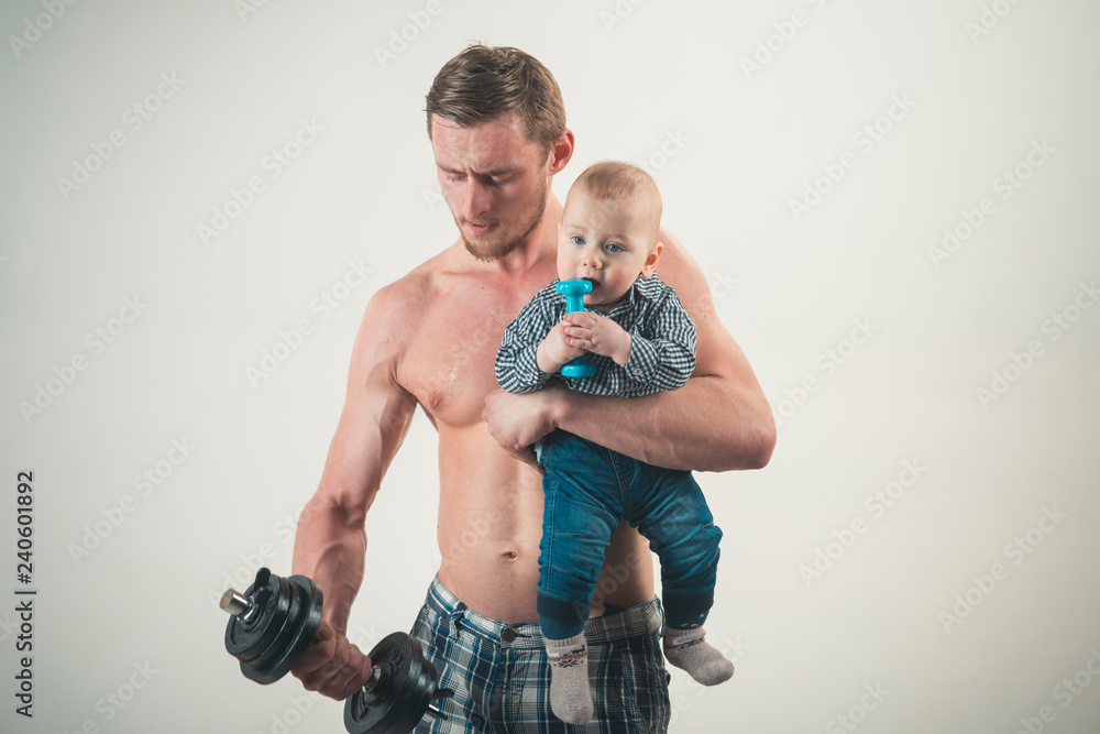 Fit and muscular. Father and son build biceps triceps. Father and child ...