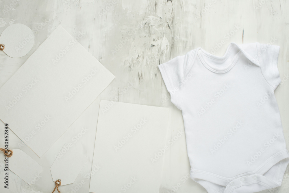 Layout Flat Lay a white children's bodysuit on a white background, with ...