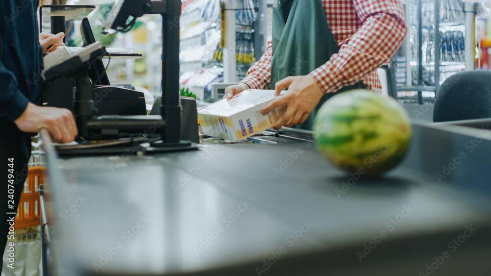 At the Supermarket: Checkout Counter Hands of the Cashier Scans ...