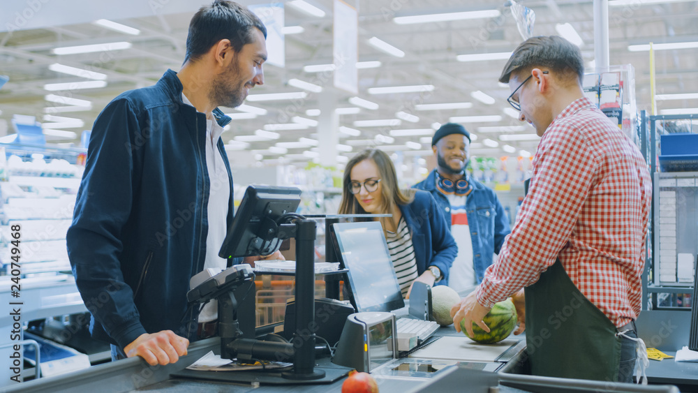 At the Supermarket: Checkout Counter Professional Cashier Scans ...