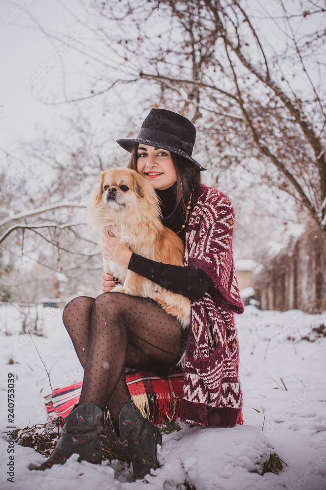 Nice latina woman with little red dog pekingese breed. Pet lover, lady ...