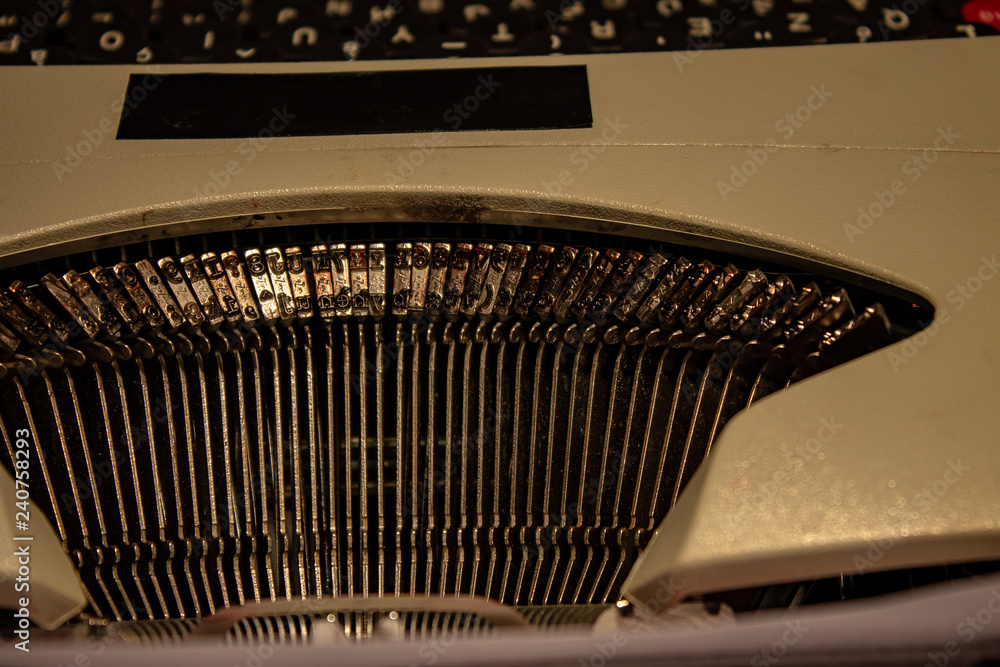 An old typewriter. Press a key and see a small arm with the letter of ...