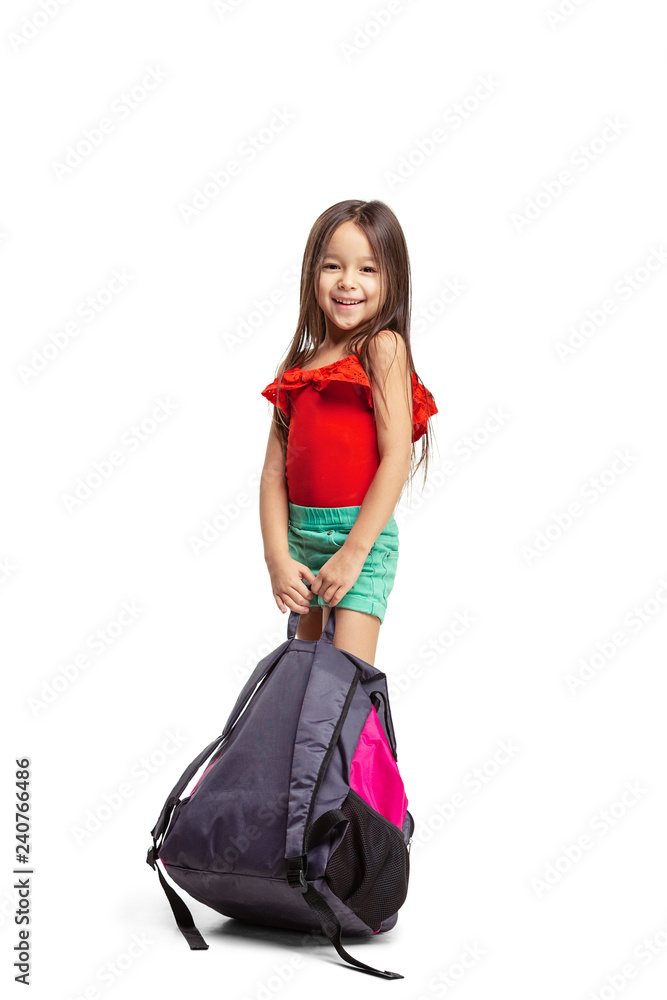 Full length portrait of cute little kid girl in stylish clothes looking ...