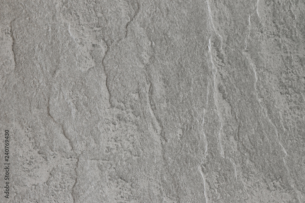 The texture of a dark gray stone with a rough and matte surface. Grunge ...