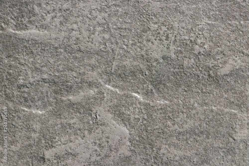 The texture of a dark gray stone with a rough and matte surface. Grunge ...