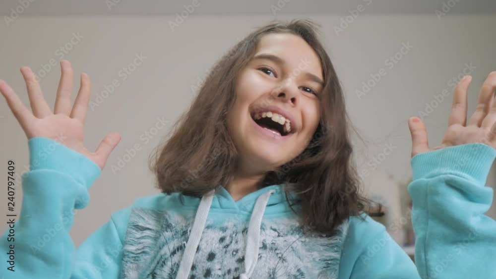 peek a boo. little girl covered lifestyle her eyes face with her hands hide - and - seek waiting ...