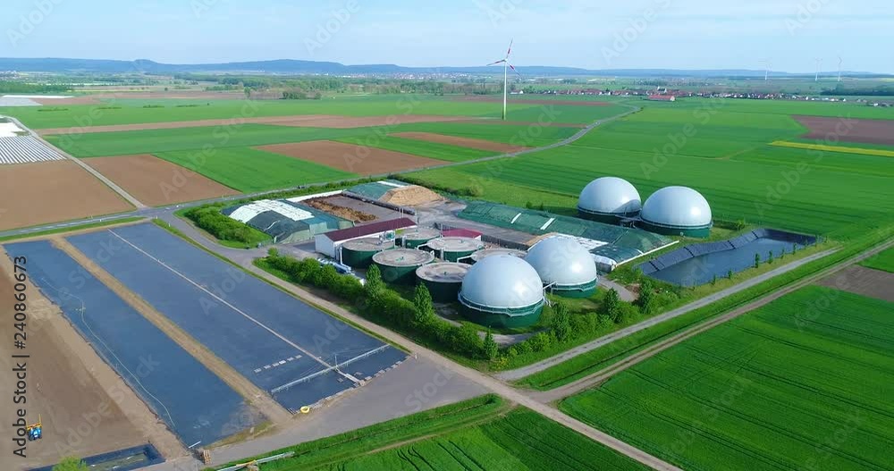 Camera flight over biogas plant from pig farm. Renewable energy from ...