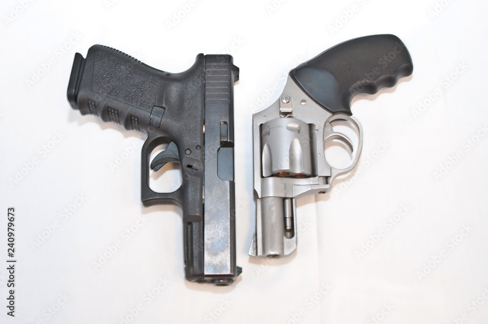 Two handguns, a black 9mm pistol and a silver 357 magnum revolver ...