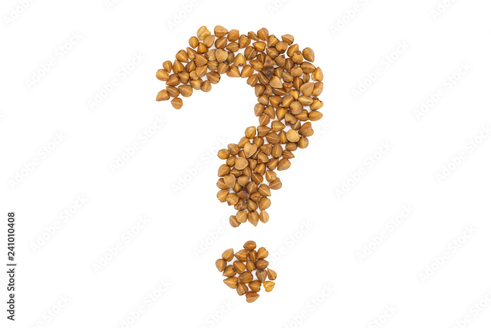 Buckwheat groats, question mark shaped, close up, isolated. Gluten free ...