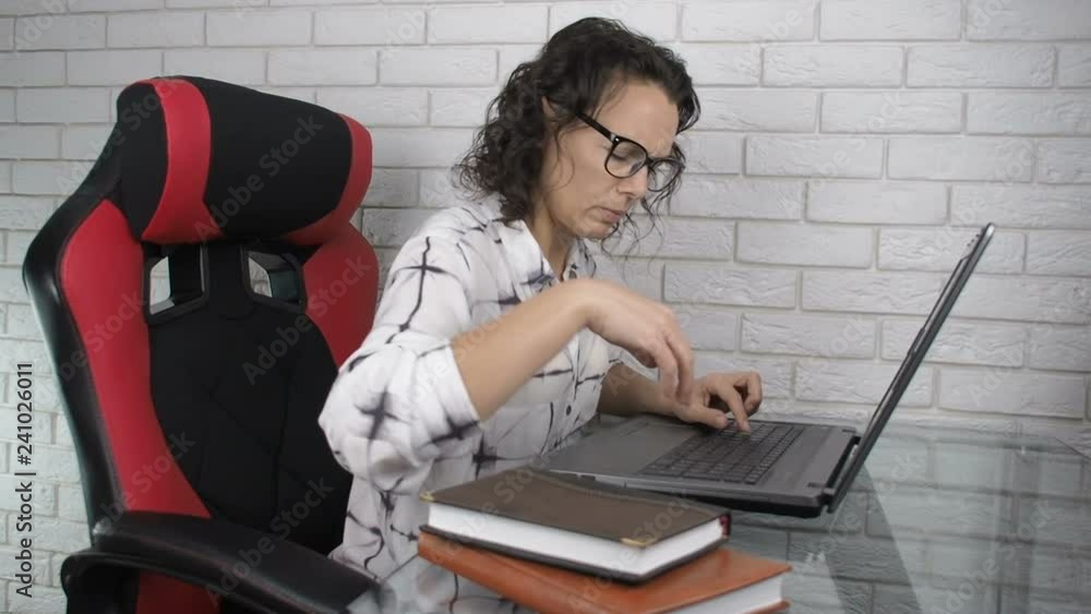 Office worker shows the middle finger. Angry woman at the workplace ...
