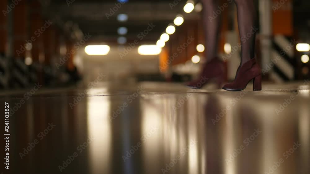 Legs in heels go past the camera in the parking lot 4K Slow Mo Stock ...