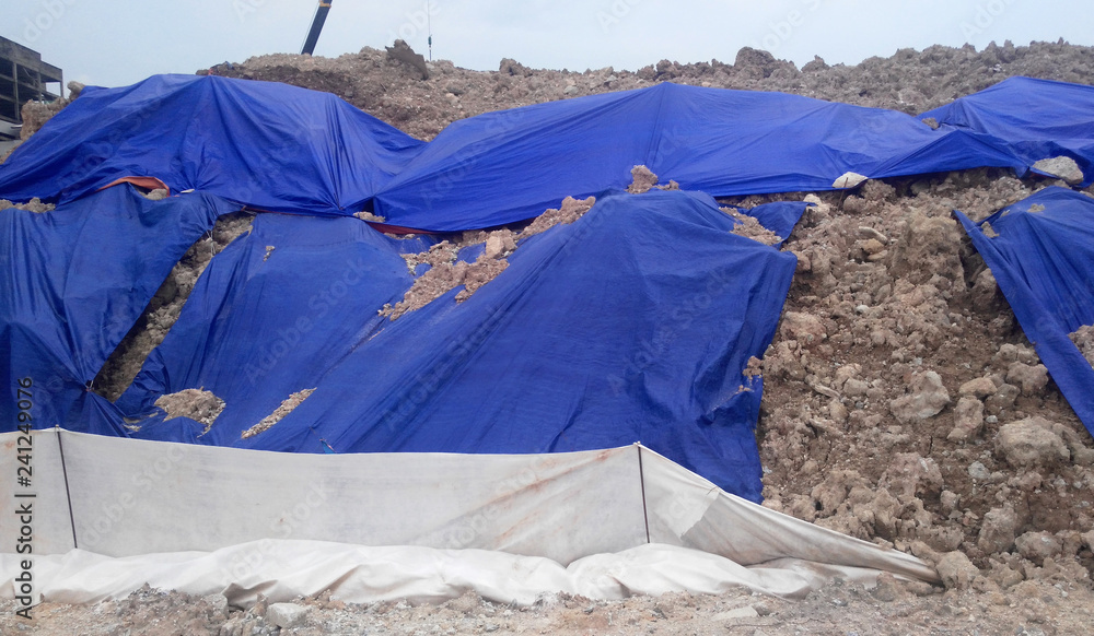 Temporary slope protection using huge plastic sheet at the construction ...