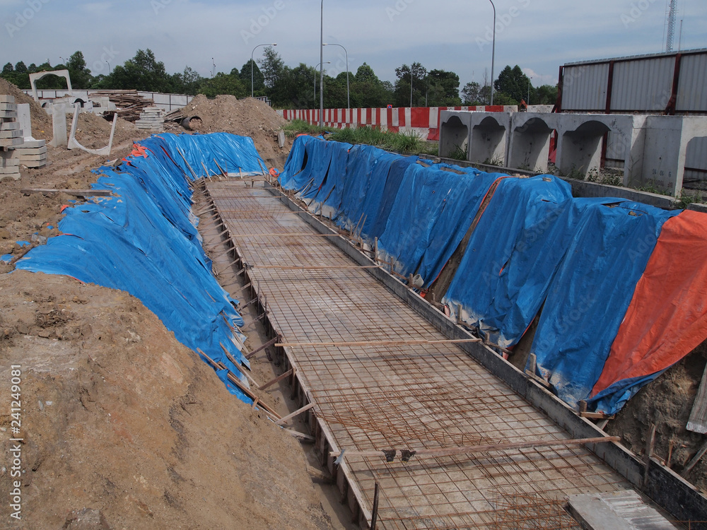 Temporary slope protection using huge plastic sheet at the construction ...
