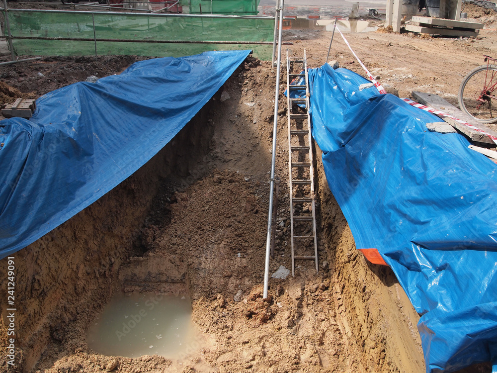 Temporary slope protection using huge plastic sheet at the construction ...
