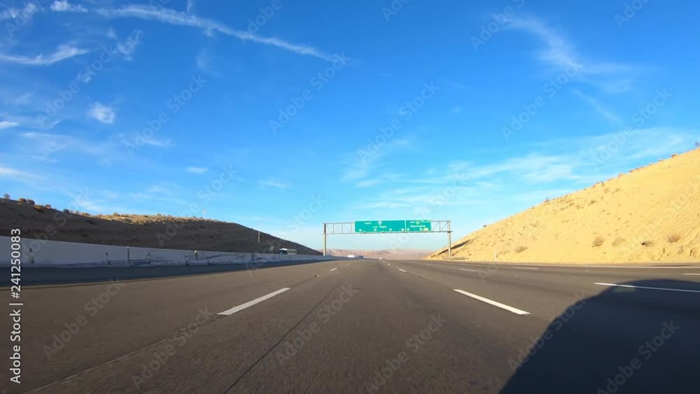 Driving view Las Vegas Interstate 15 overhead freeway sign in Barstow ...