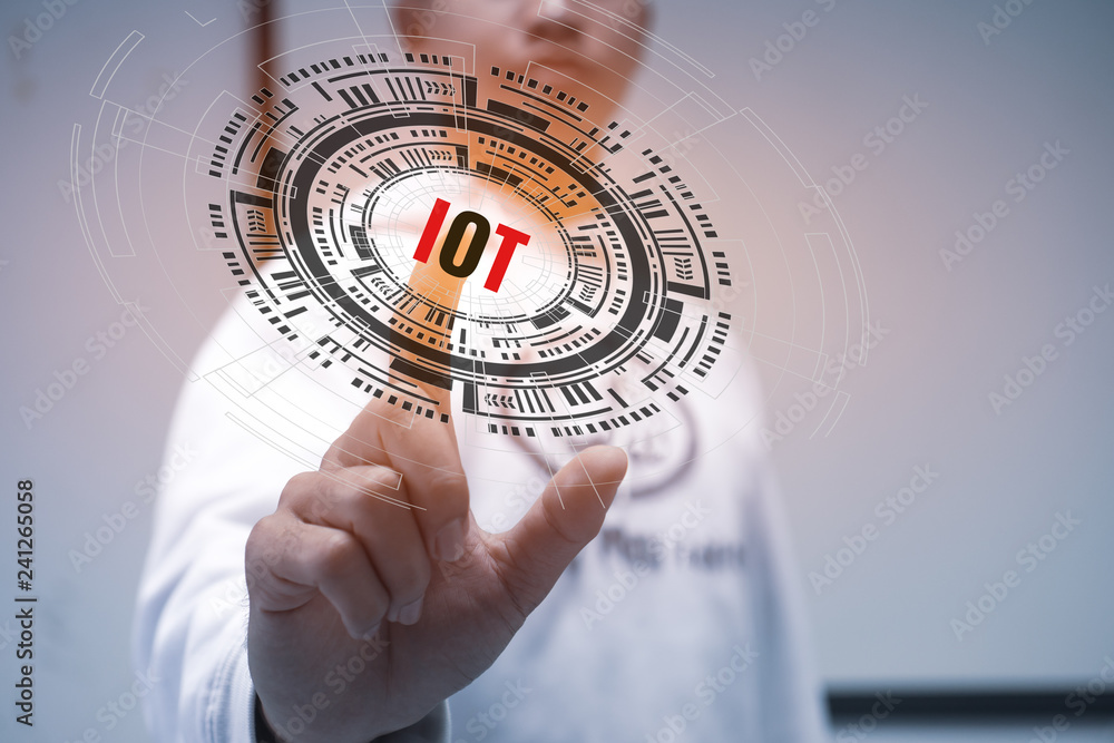 Internet of things / IOT concept. Businessman touching presented symbol ...