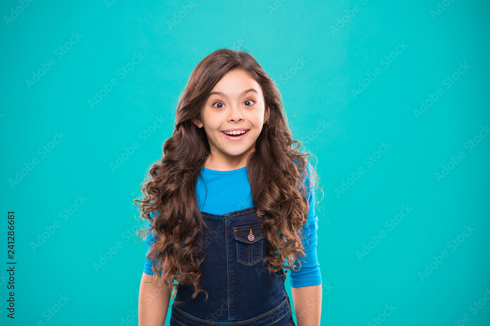 Kid girl long healthy shiny hair wear casual clothes. Little girl ...