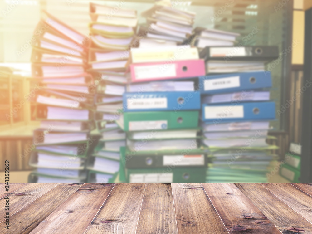 Wood table top over file stack at office background. Stock Photo ...