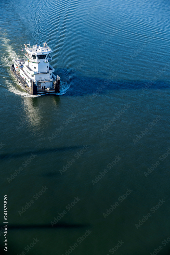 Powerful modern river tug floats down the river to the port of ...
