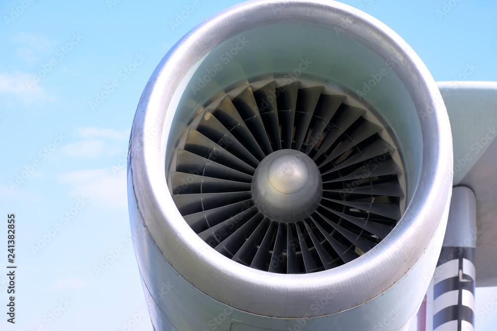 jet engine of an airplane on blue sky background. turbine of an plane ...