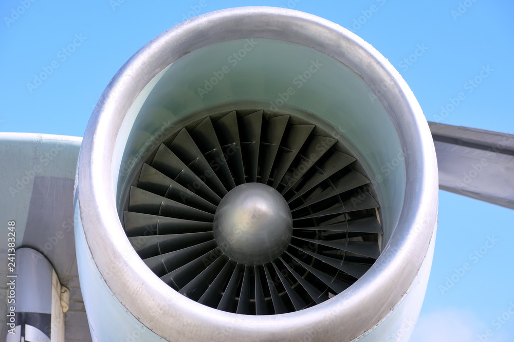 jet engine of an airplane on blue sky background. turbine of an plane ...