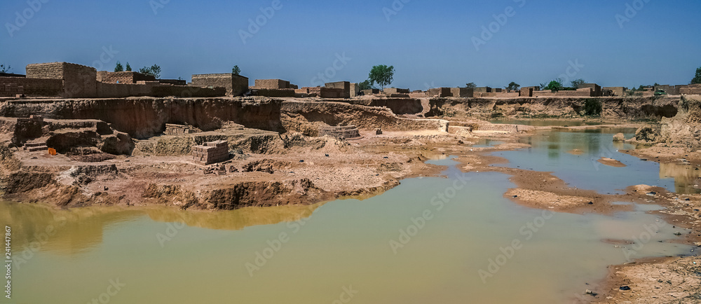 Brickyard in the slums of Ouagadougou which looks like a gigantic ...
