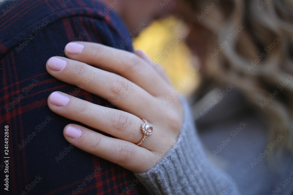 Engagement Photography: Woman with Curly Blond Hair Embracing Fiance ...
