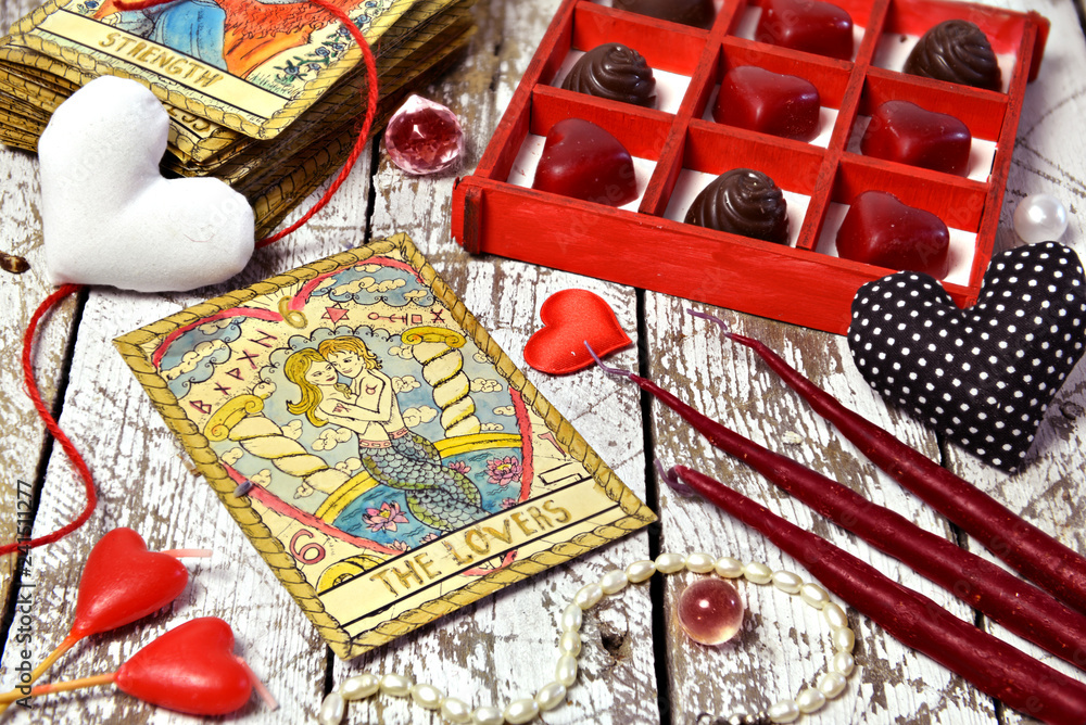 Love magic ritual with red candles, tarot card Lovers, heart symbols ...