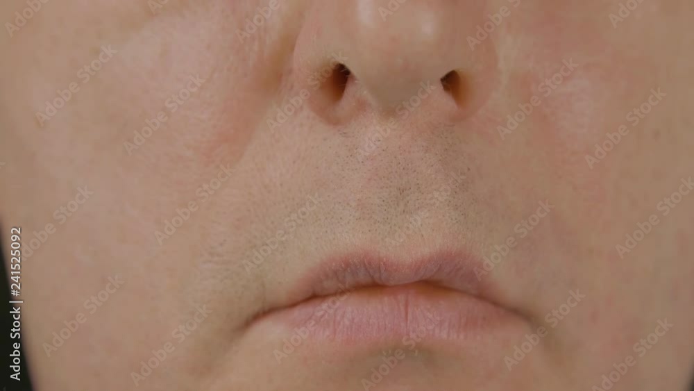 Video „Close up male mouth, lips and nose. Clean shaven male face ...