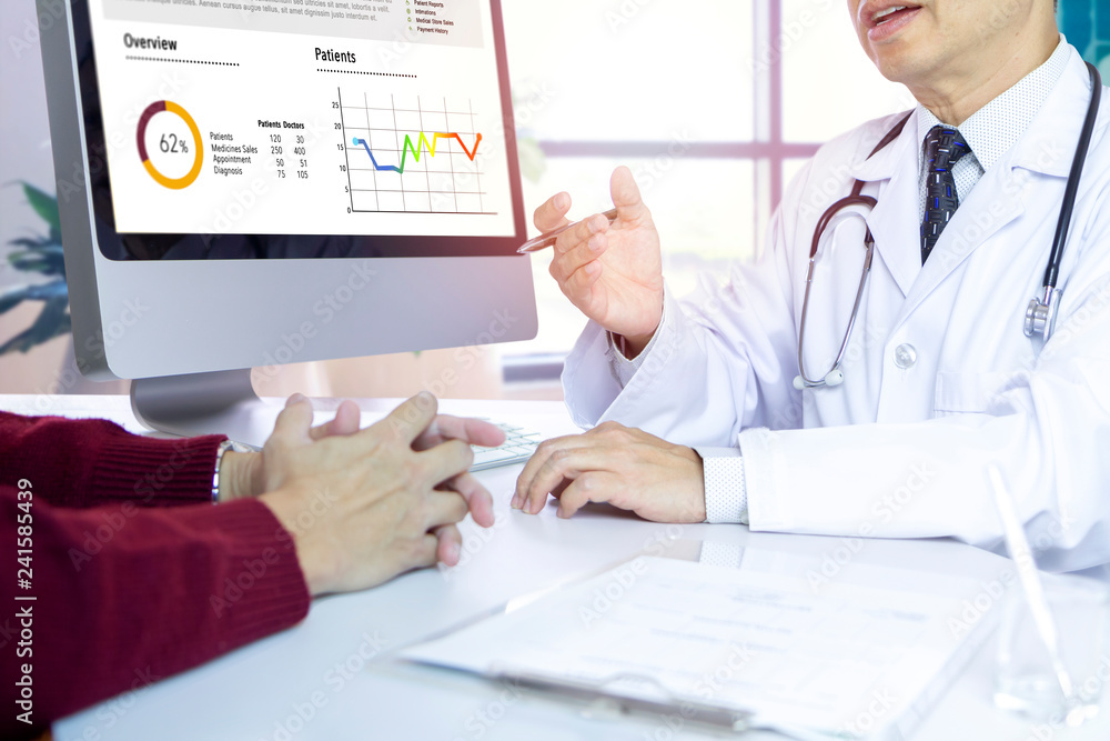 Male doctor giving a consultation to his patient with medical diagnosis ...